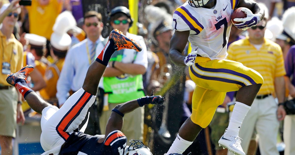 LSU running back bowls over Auburn defenders | The Seattle Times