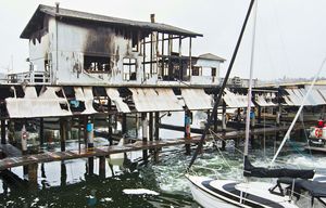 Candle blamed for marina fire that damaged boats, gutted building | The ...