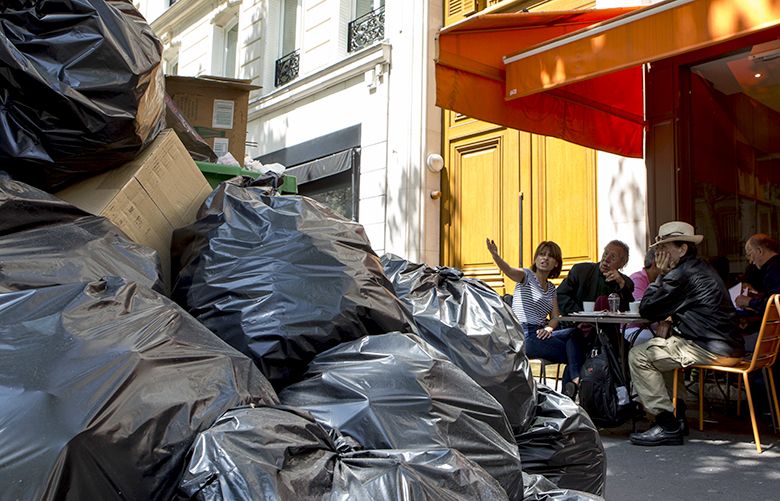 As unions protest, the garbage piles up in Paris streets | The Seattle ...