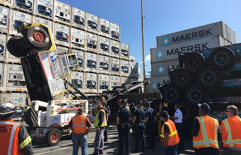 Driver rescued from overturned loader on Seattle waterfront | The ...