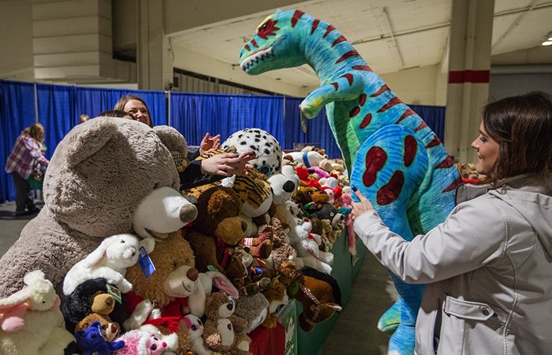 Volunteer elves prepare for Salvation Army toy giveaway | The Seattle Times