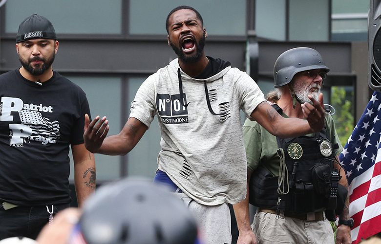 Trump supporters confronted by counter-protesters during Seattle rally ...