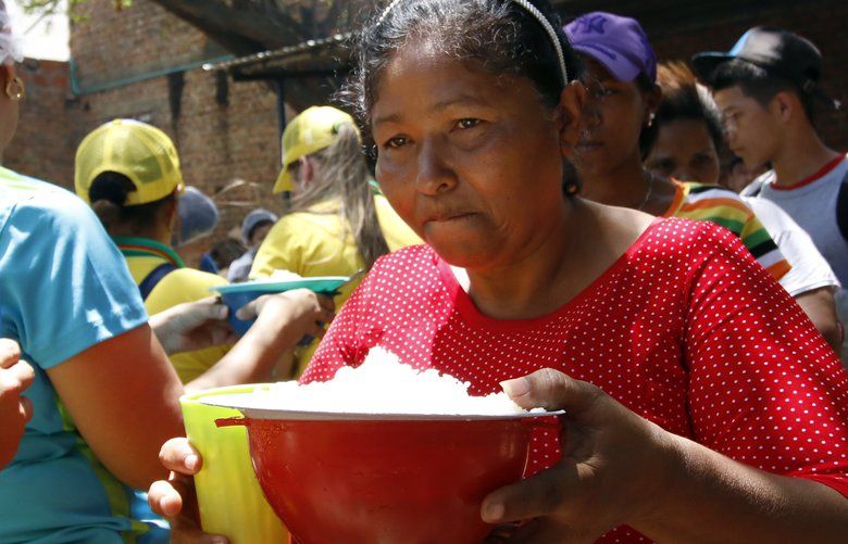 Hungry Venezuelans turn to Colombia for a plate of food | The Seattle Times
