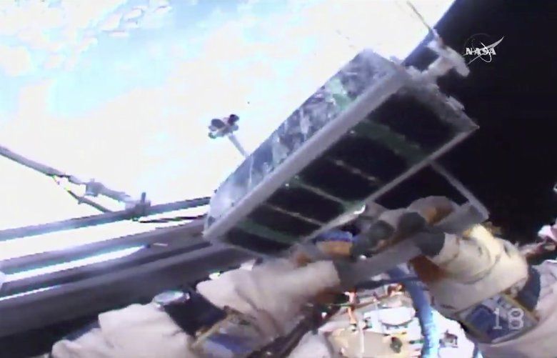 Spacewalking cosmonauts release 3-D-printed satellite | The Seattle Times