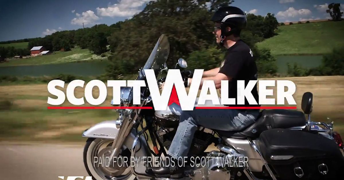Walker rides Harley, jogs in new video touting record | The Seattle Times
