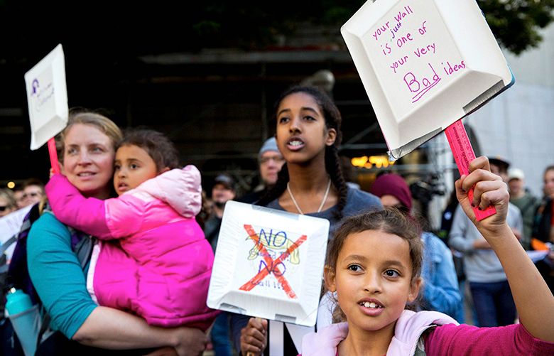 ‘Time for moral courage’: Seattle crowd protests Trump’s immigration ...