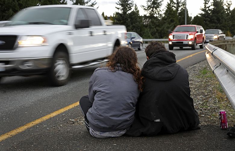 Give to panhandlers or don’t? Some towns try cracking down | The ...