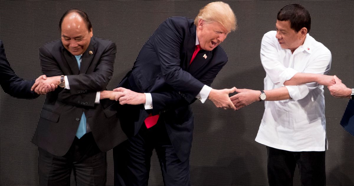 Trump’s handshake challenge: He grimaces, grins, grips | The Seattle Times
