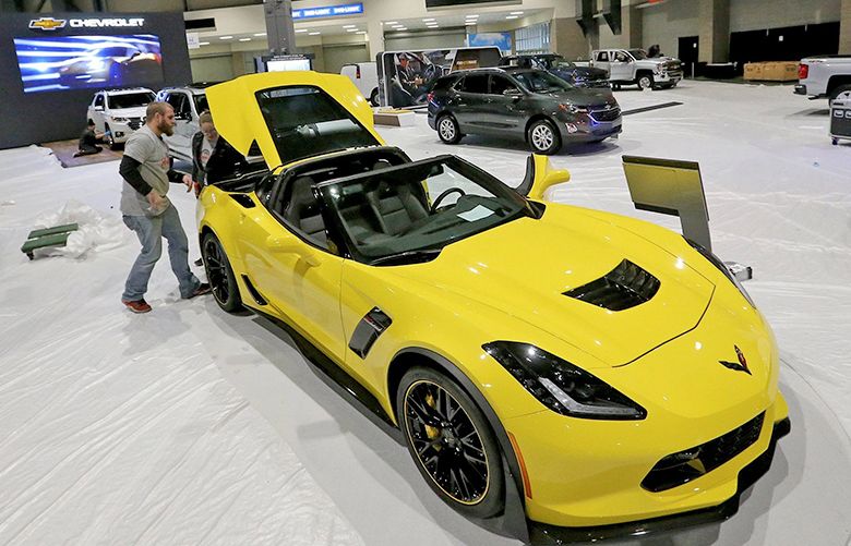 Detailers put finishing touches on cars for the Auto Show | The Seattle ...