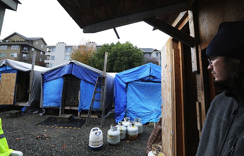 Some rocky political theater, but Seattle homeless camp stays in ...