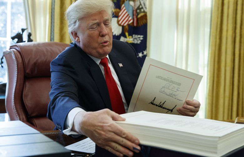 Trump signs, lauds tax overhaul, off to Florida for holidays | The ...