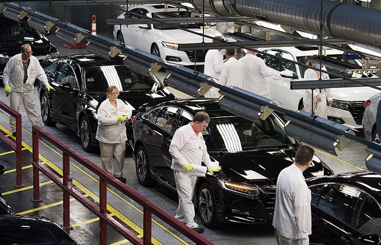 Robots take a back seat as humans build the best new car you can buy ...