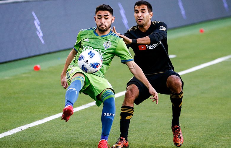 Sounders rookie Alex Roldan hits the field, then the books | The ...