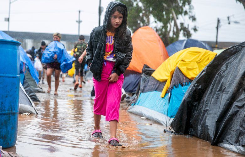 Mexico starts moving some migrants to new shelter | The Seattle Times