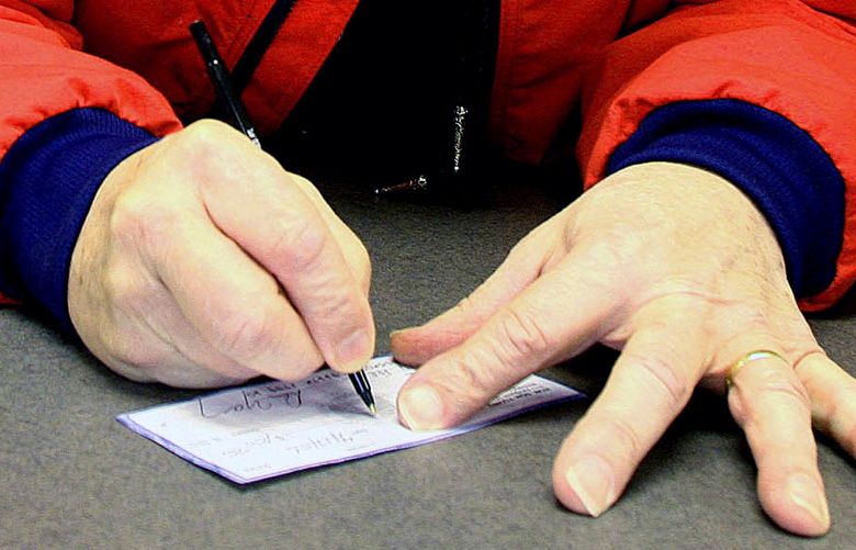 That ‘live check’ promises cash, but there’s a catch | The Seattle Times