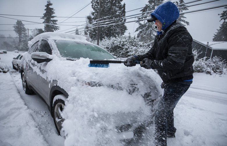 Scenes from a snowy day around Seattle | The Seattle Times