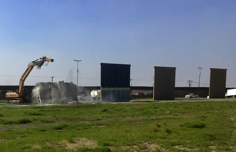 Amid clouds of dust, border wall prototypes are demolished | The ...