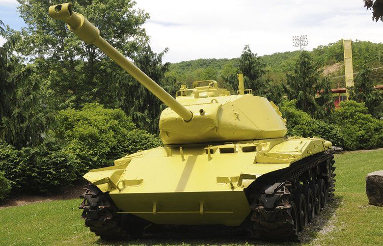 Ready, aim, oops! Historic tank turns lemon-lime yellow | The Seattle Times