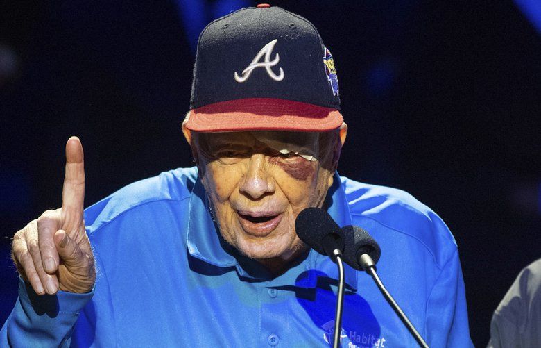 Despite fall, former President Carter helps build home | The Seattle Times