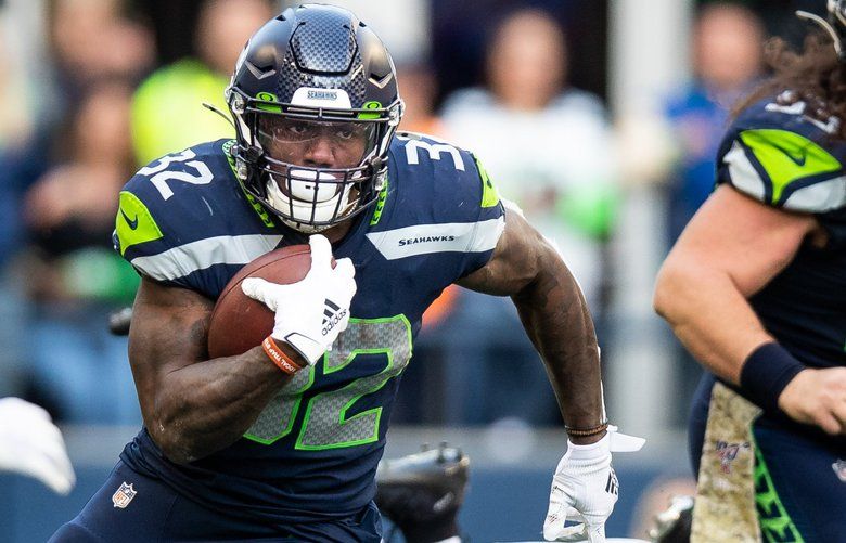 Best bargain in the NFL? Seahawks running back Chris Carson fits the ...