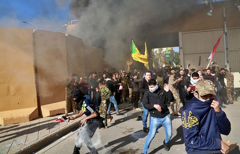 Protesters attack US Embassy in Baghdad after airstrikes | The Seattle ...