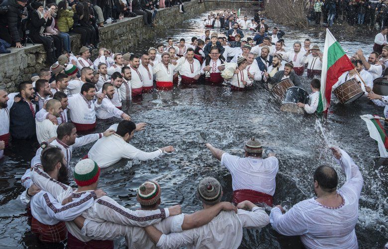 Seeking the cross: Icy dips mark the feast of Epiphany | The Seattle Times