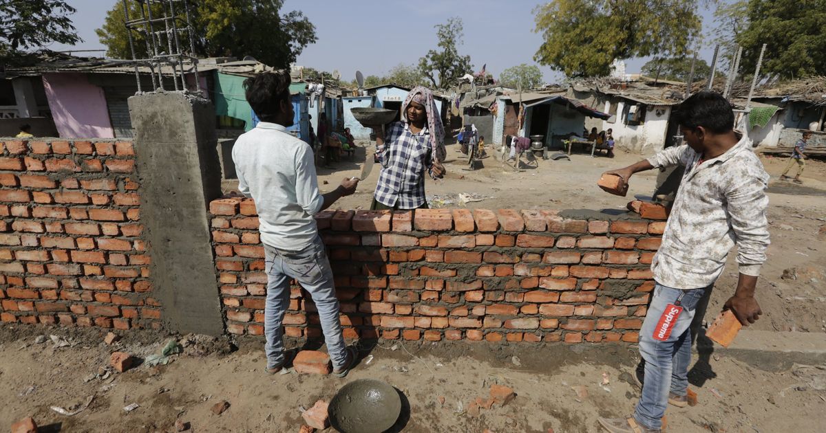 As Trump prepares to visit, a wall rises in India | The Seattle Times
