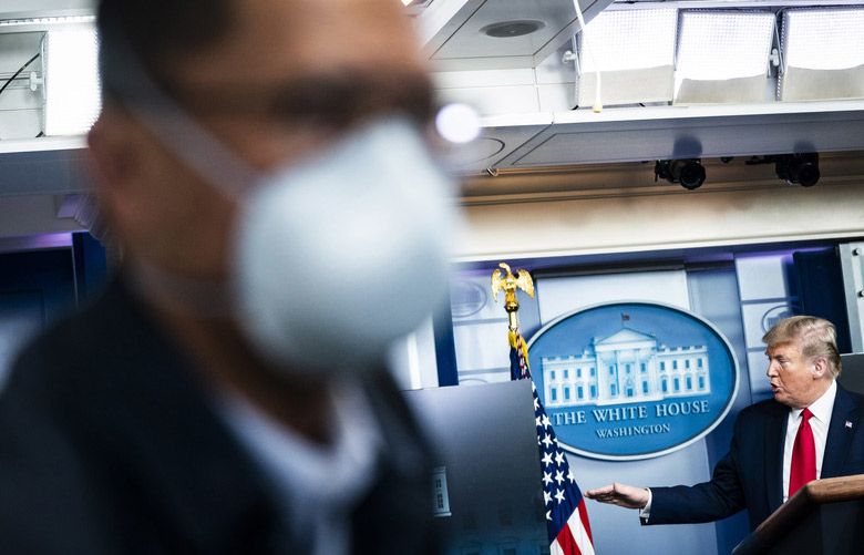 As U.S. discouraged public mask use, White House raced to secure them ...