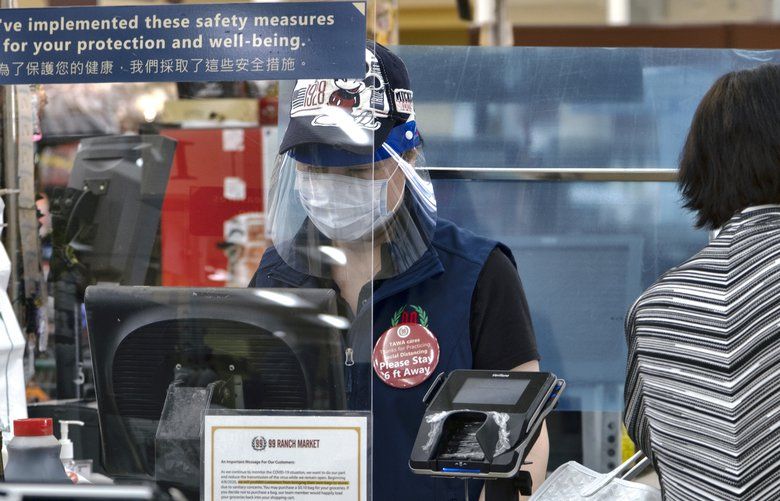 Store workers become enforcers of social distancing rules | The Seattle ...