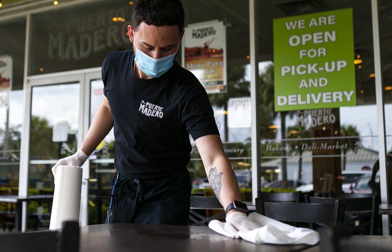 Virus ‘does not spread easily’ from contaminated surfaces, revised CDC ...