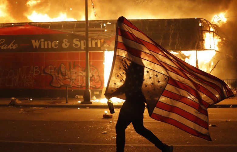 AP photo of flag-bearing protester rockets around the world | The ...