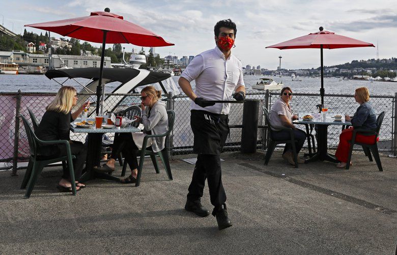 Servers in face masks and surgical gloves: How one classic Seattle ...