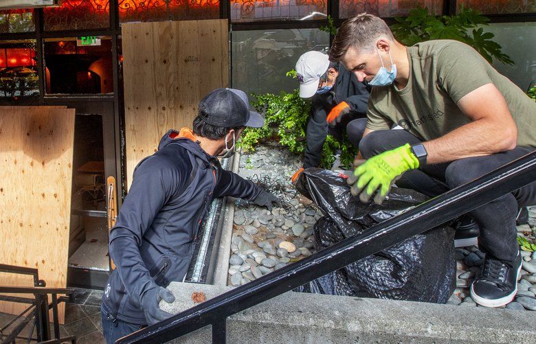 Photos: Cleaning up Seattle and Bellevue after a weekend of protests ...