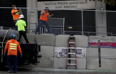 Photos: Wall around Seattle Police Department’s East Precinct grows ...