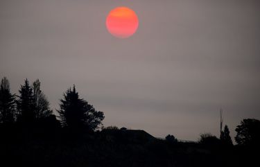Hazy sunrise is reminder of returning smoke | The Seattle Times