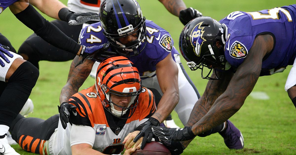Burrow finds Ravens D to be painful experience | The Seattle Times
