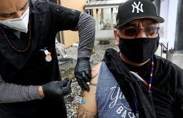 How a Native American COVID-19 vaccine rollout is a model for community ...