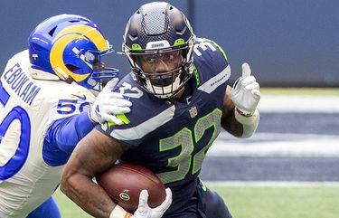Happy to be back with Seahawks, Chris Carson says Seattle running game ...