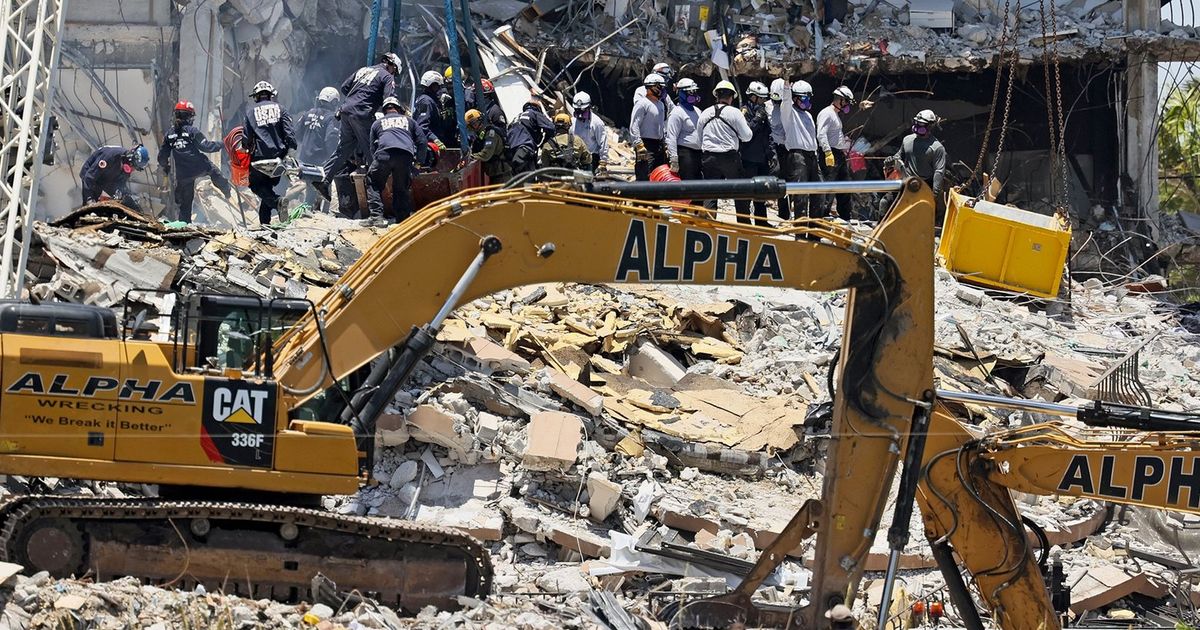 Crews spend 5th day atop shaky pile of collapsed concrete | The Seattle ...