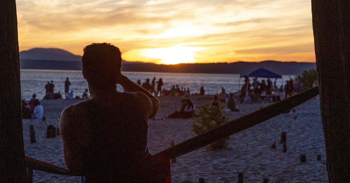 Soaking in a sunny summer solstice at Seattle’s Golden Gardens Park ...