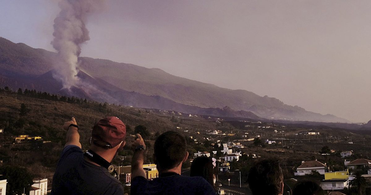 Lava from Spanish volcano surges after crater collapse | The Seattle Times