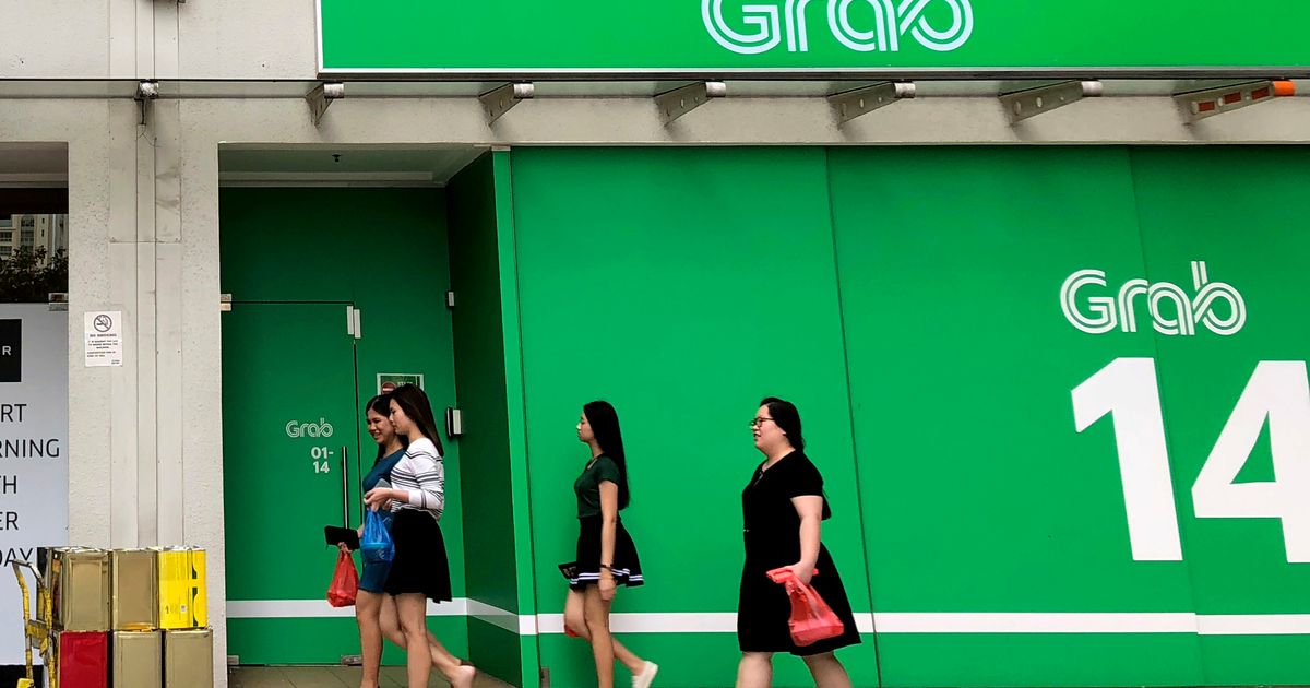 Grab goes public in $40B SPAC deal, slides in market debut | The ...