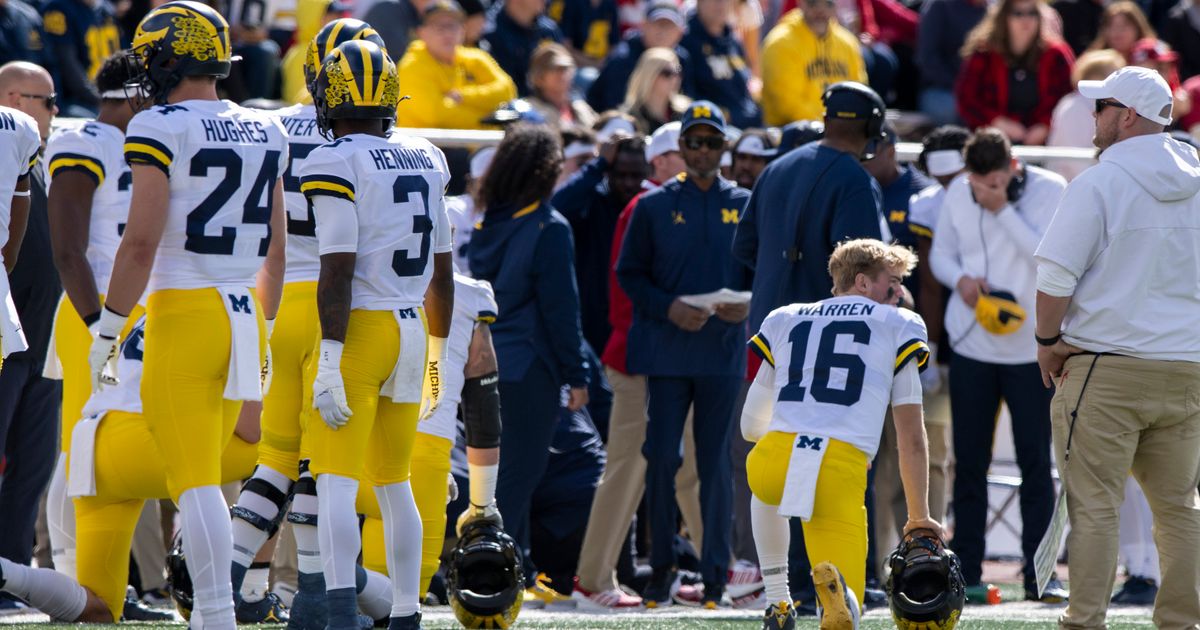 Michigan assistant coach Hart carted off field on backboard | The ...