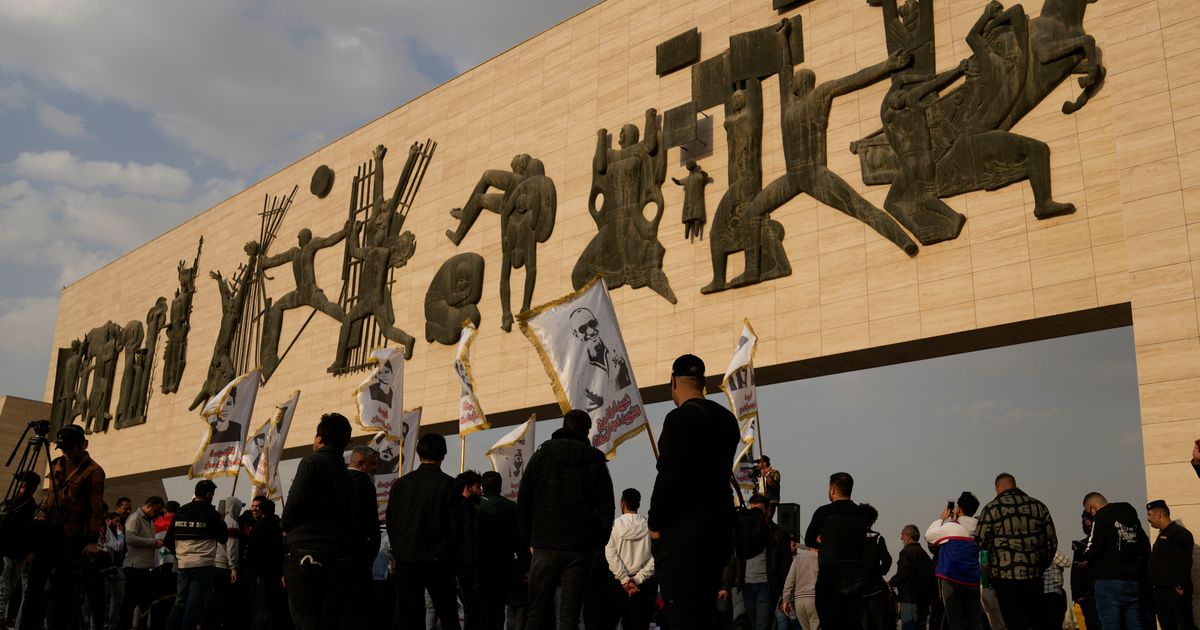 Iraqis protest in Baghdad as currency crisis continues | The Seattle Times