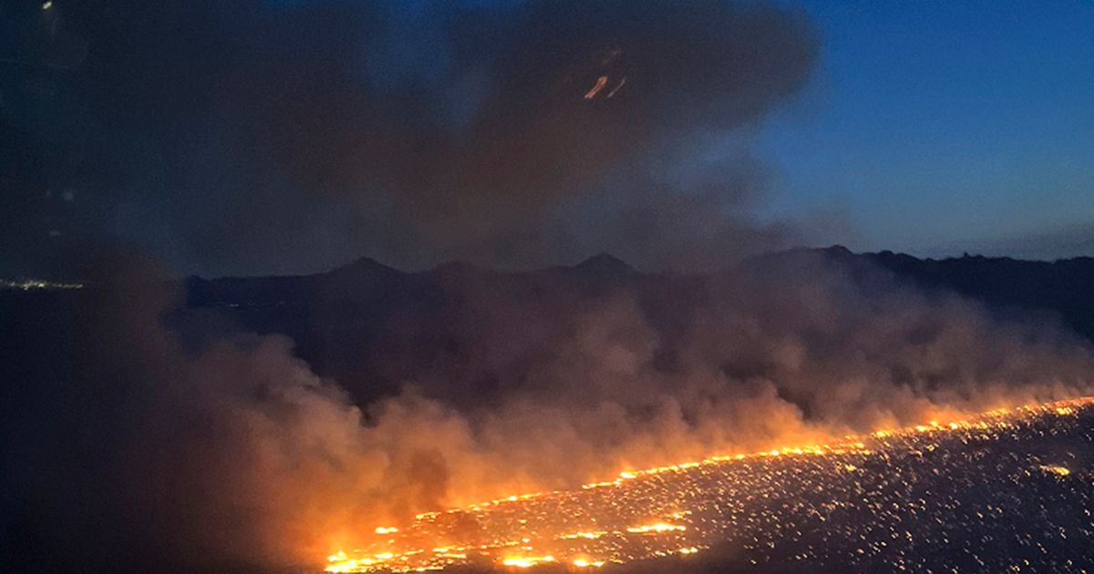 1,145 people remain evacuated as crews dig containment line around ...