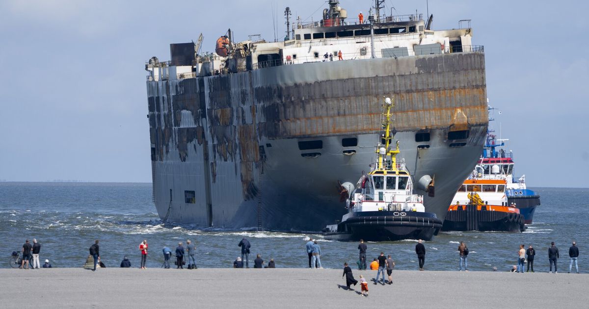 A car-carrying ship that burned for a week on the North Sea is towed to ...