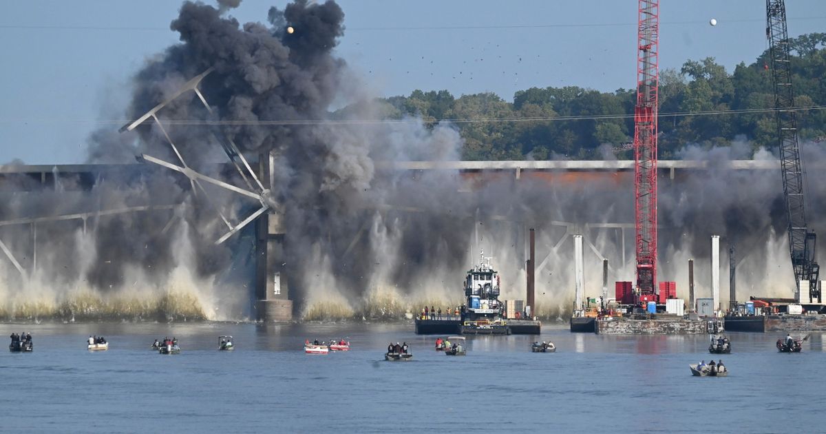 Explosives drop steel trestle Missouri River bridge into the water ...