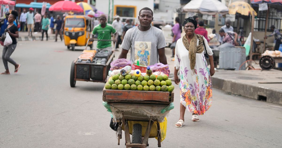Nigerian workers walk off the job again to protest rising costs after ...