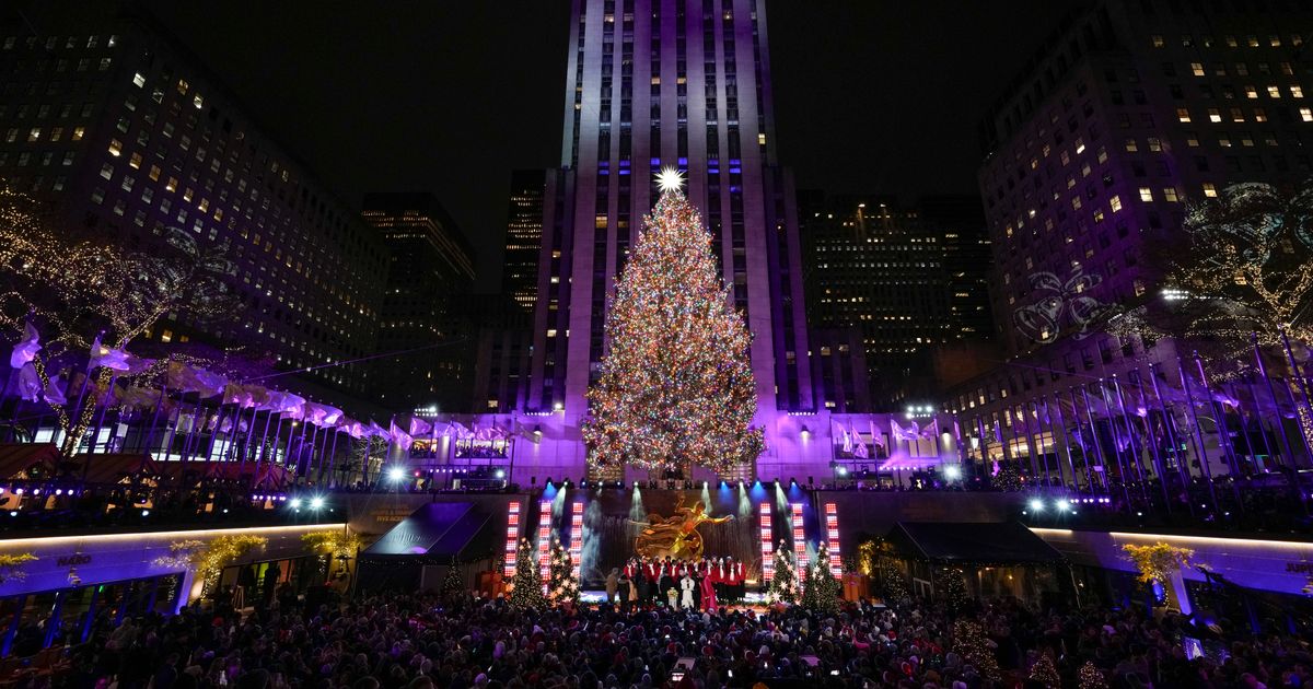 Iconic Christmas tree at Rockefeller Center illuminated in midst of pro ...
