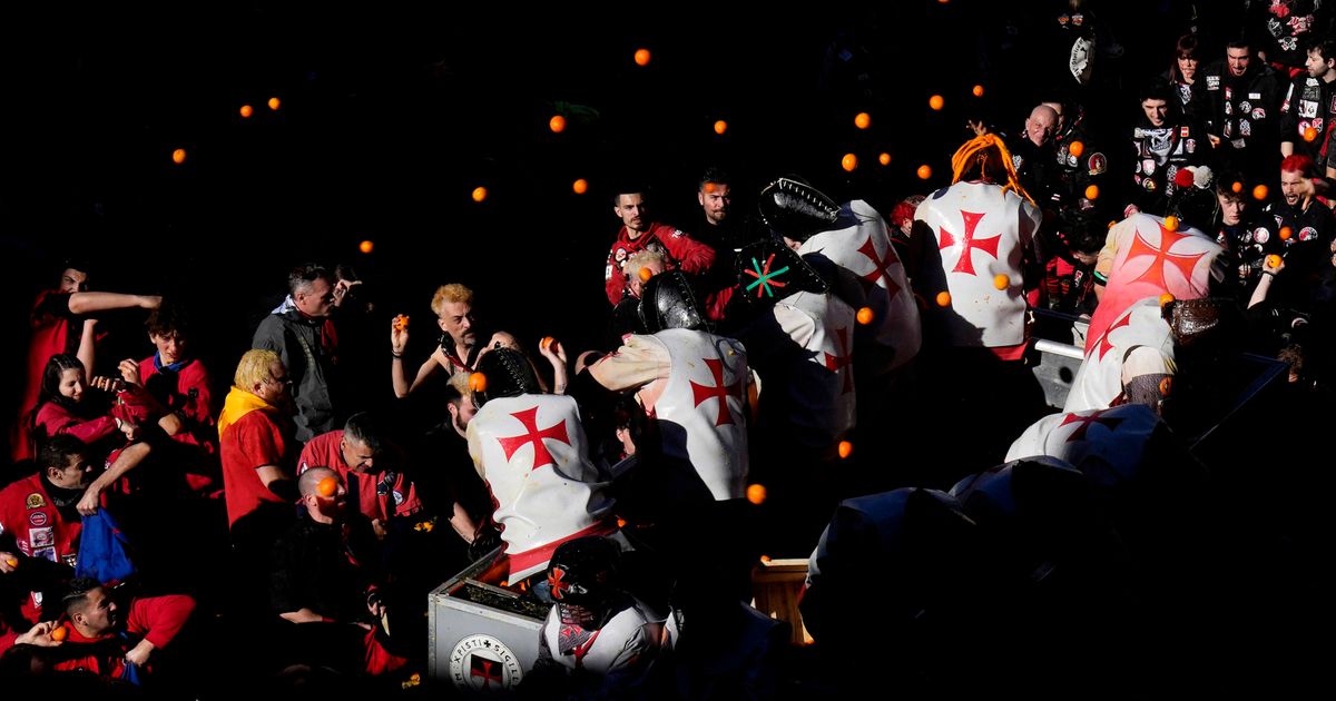 AP PHOTOS: Pulp flies in traditional orange battle during Carnival in ...